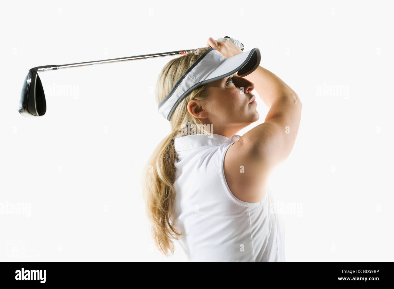 Golfer swinging a club Cut Out Stock Images & Pictures - Alamy