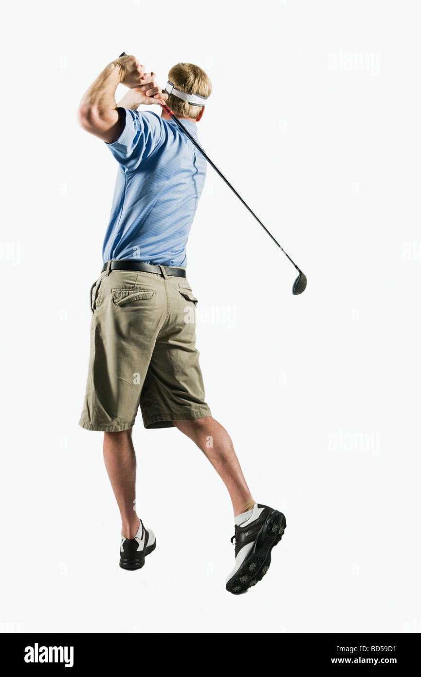 Golfer swinging a club Cut Out Stock Images & Pictures - Alamy