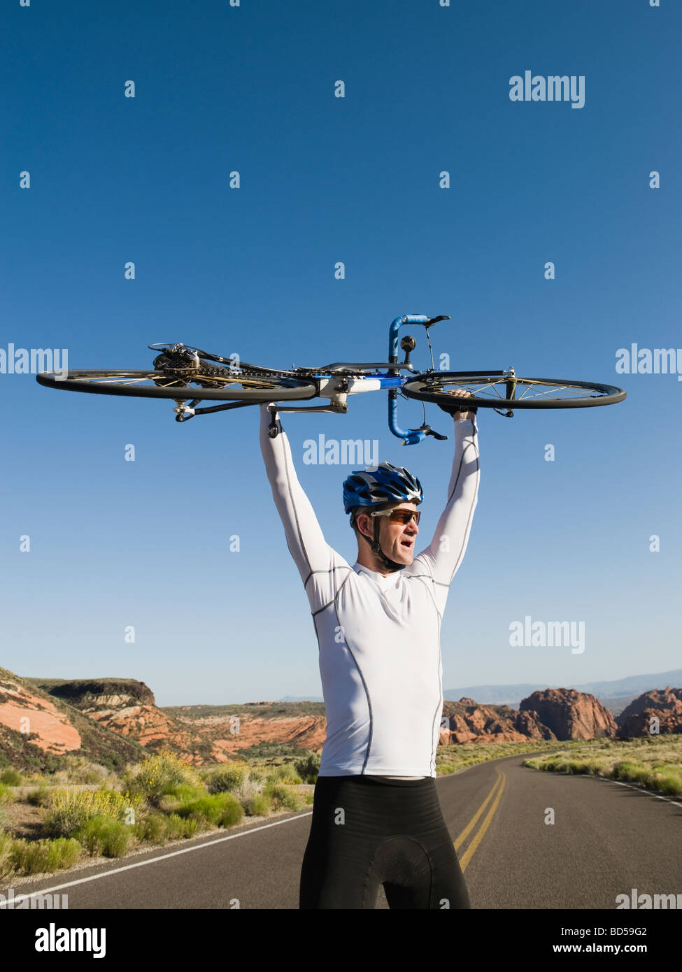 Middle aged man holding bike up hi-res stock photography and images - Alamy