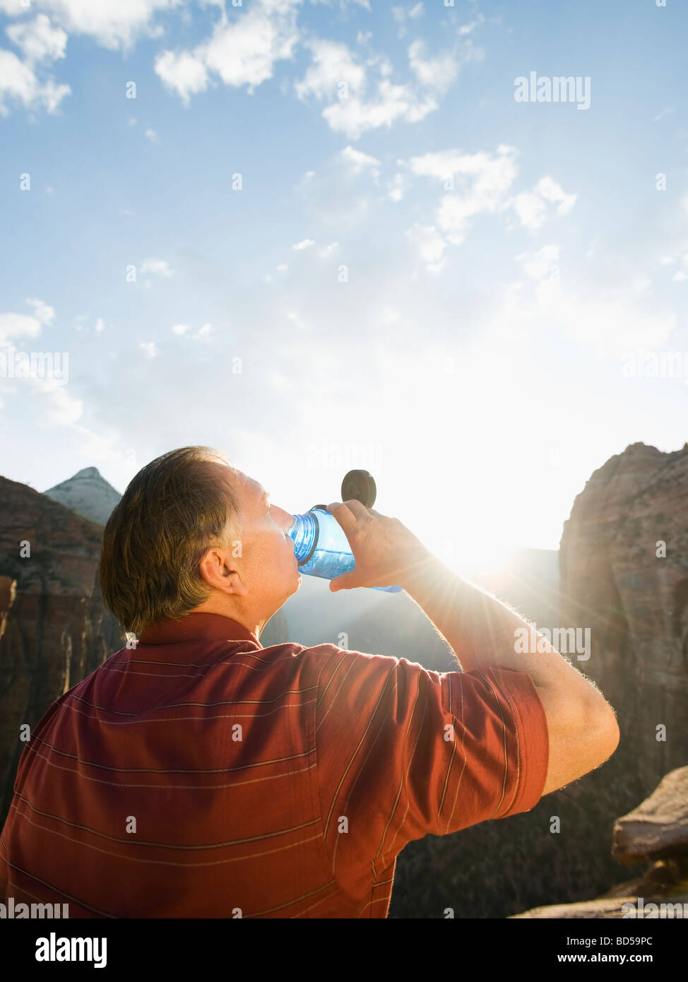 A man drinking water at Red Rock Stock Photo - Alamy