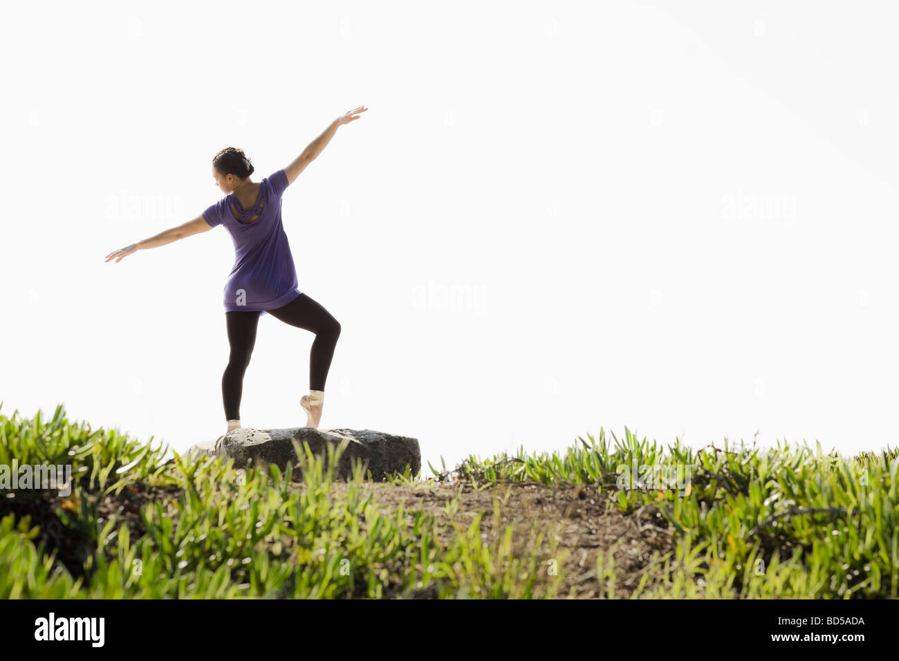 A woman dancing outdoors Stock Photo - Alamy