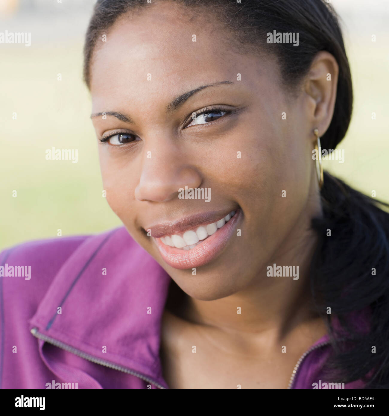 A woman outdoors smiling Stock Photo - Alamy