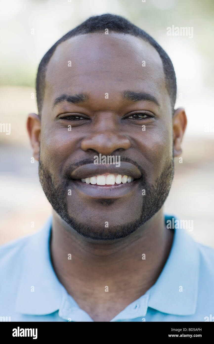 A man outdoors smiling Stock Photo - Alamy