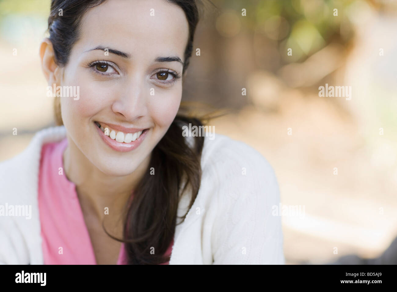 A woman outdoors smiling Stock Photo - Alamy