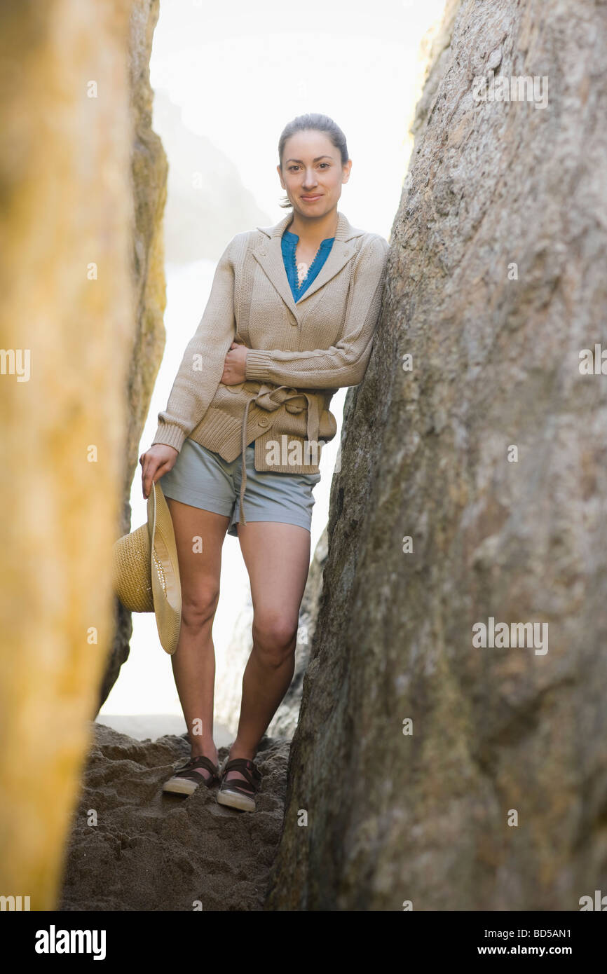 A woman standing between two rock walls Stock Photo - Alamy