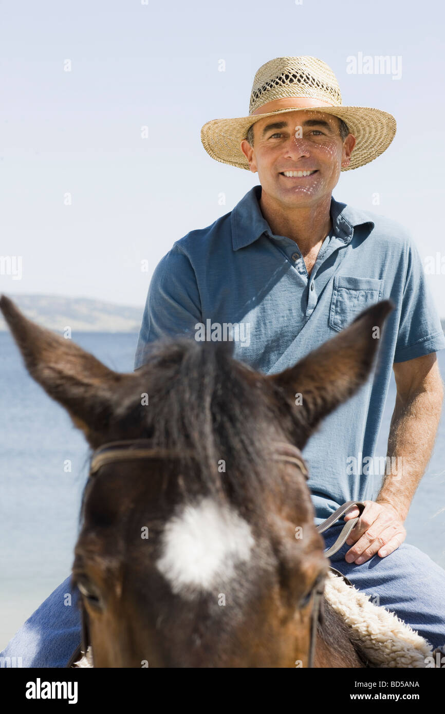 A man riding a horse Stock Photo - Alamy