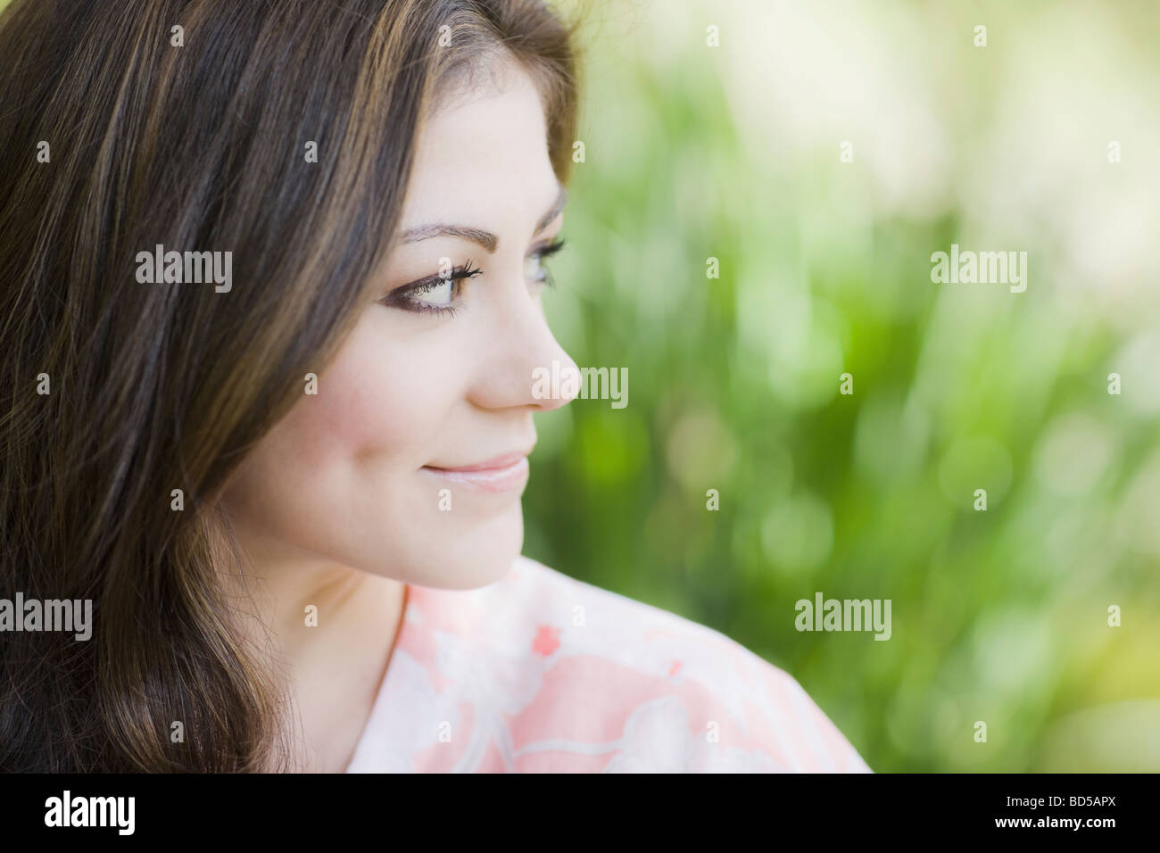A woman outdoors smiling Stock Photo - Alamy