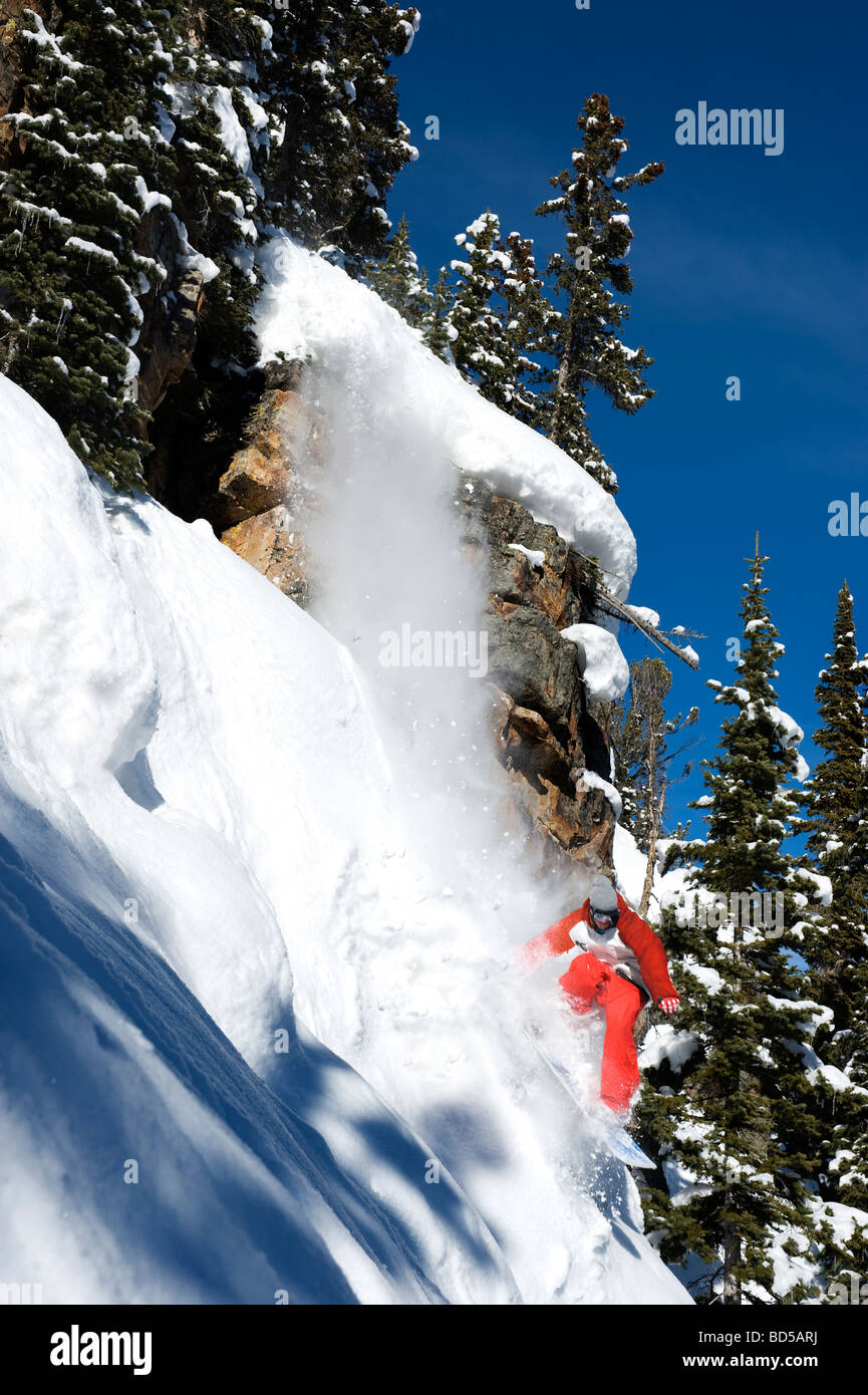 Low angle view of male snowboarder jumping against sky Stock Photo - Alamy