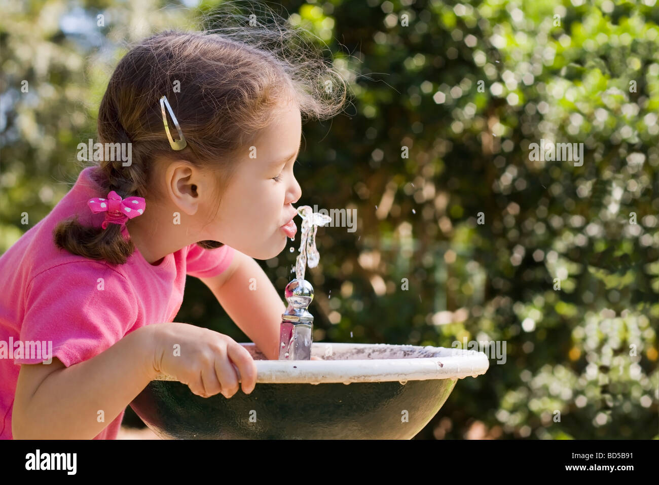 Kid Drinking Water From Fountain