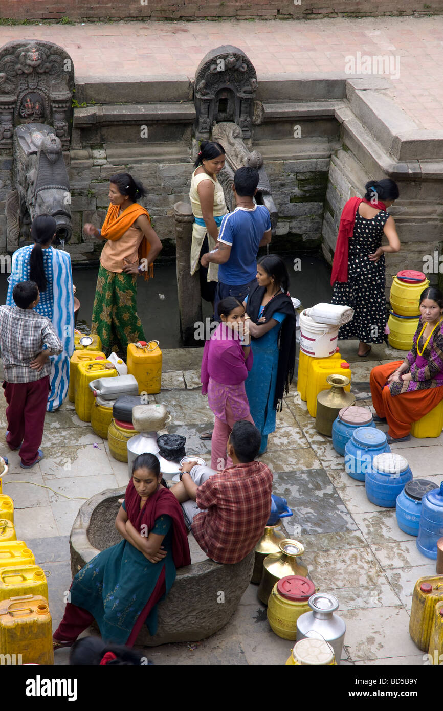 indian women at the well in durbar square patan collecting water Stock ...