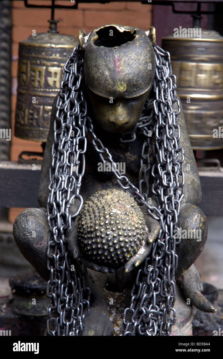 monkey statue with chains in temple Stock Photo - Alamy