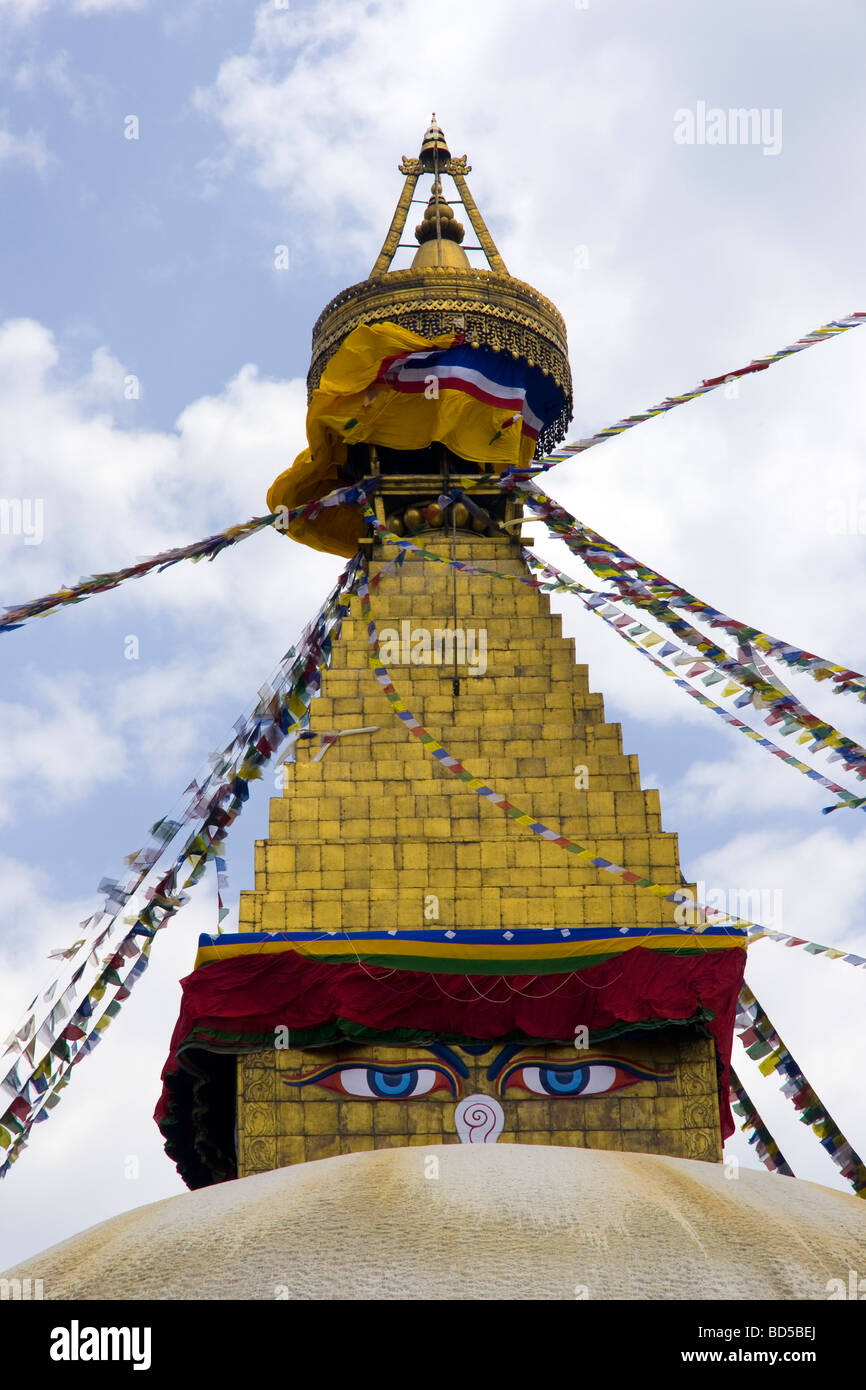 prayer flags and golden stupa with all seeing eyes of buddah Stock ...