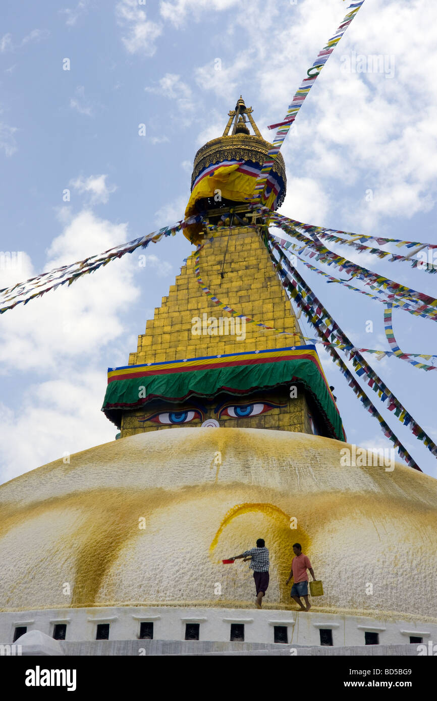 nepali workers carrying out painting patterns on the chorten or stupa ...