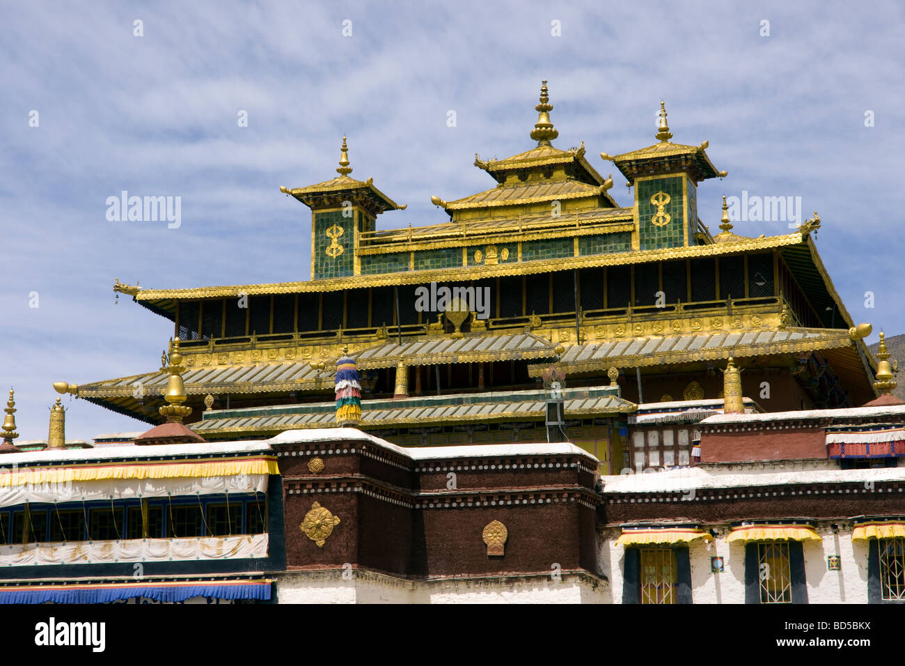 traditional tibetan architecture with golden roofs on the main utse ...