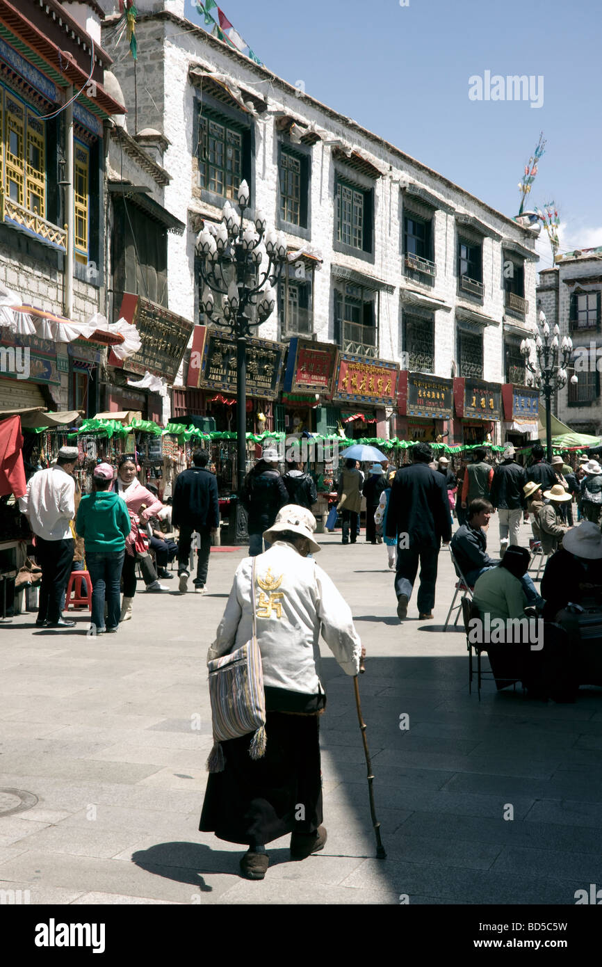 tibetan pilgrim walking the barkhor circuit in lhasa Stock Photo - Alamy