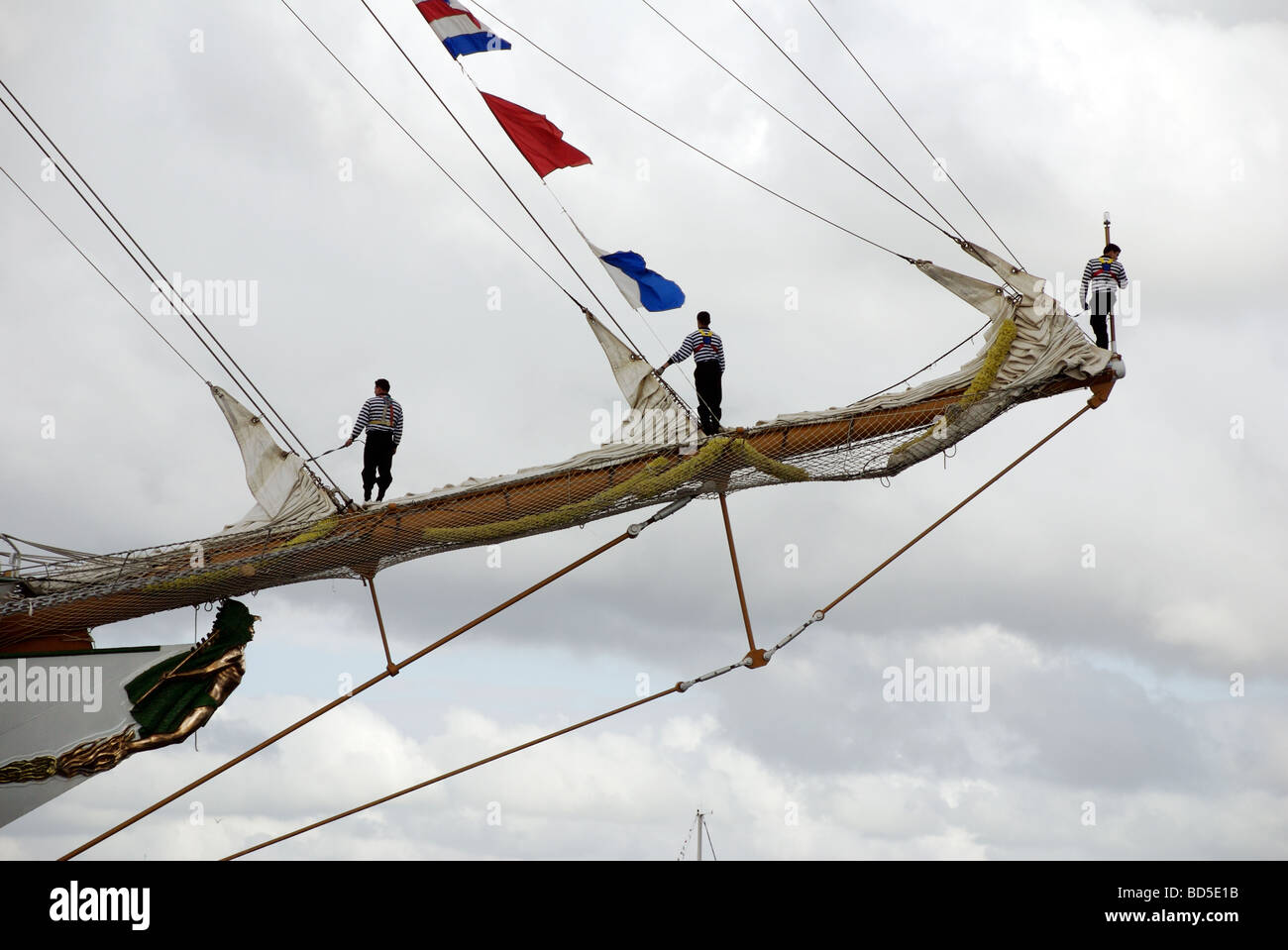 Sailors balance on the bowsprit of Mexican three masted barque ...