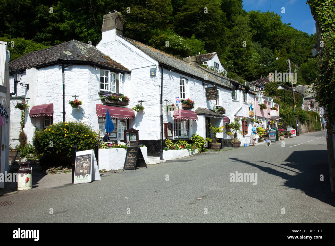 Main pedestrianised street in the coastal fishing village of Polperro ...