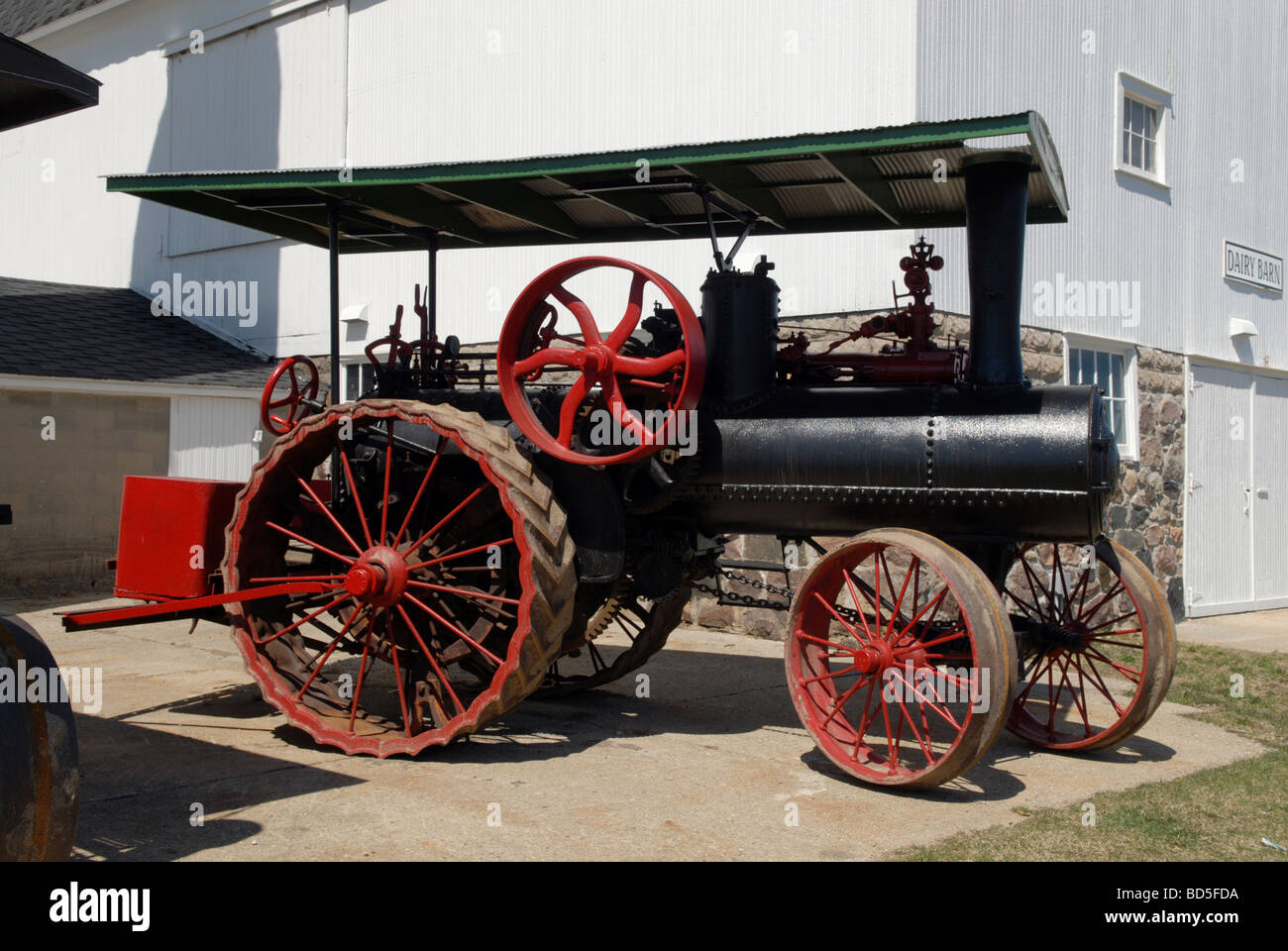 A century-old steam-engined tractor sits at an antique tractor museum ...