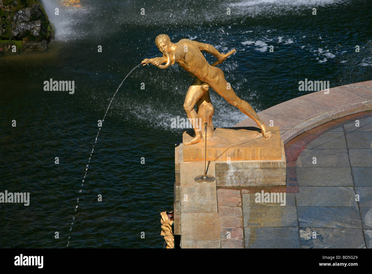 Gilded statue of Apollo holding the snake Python at the Grand Cascade ...