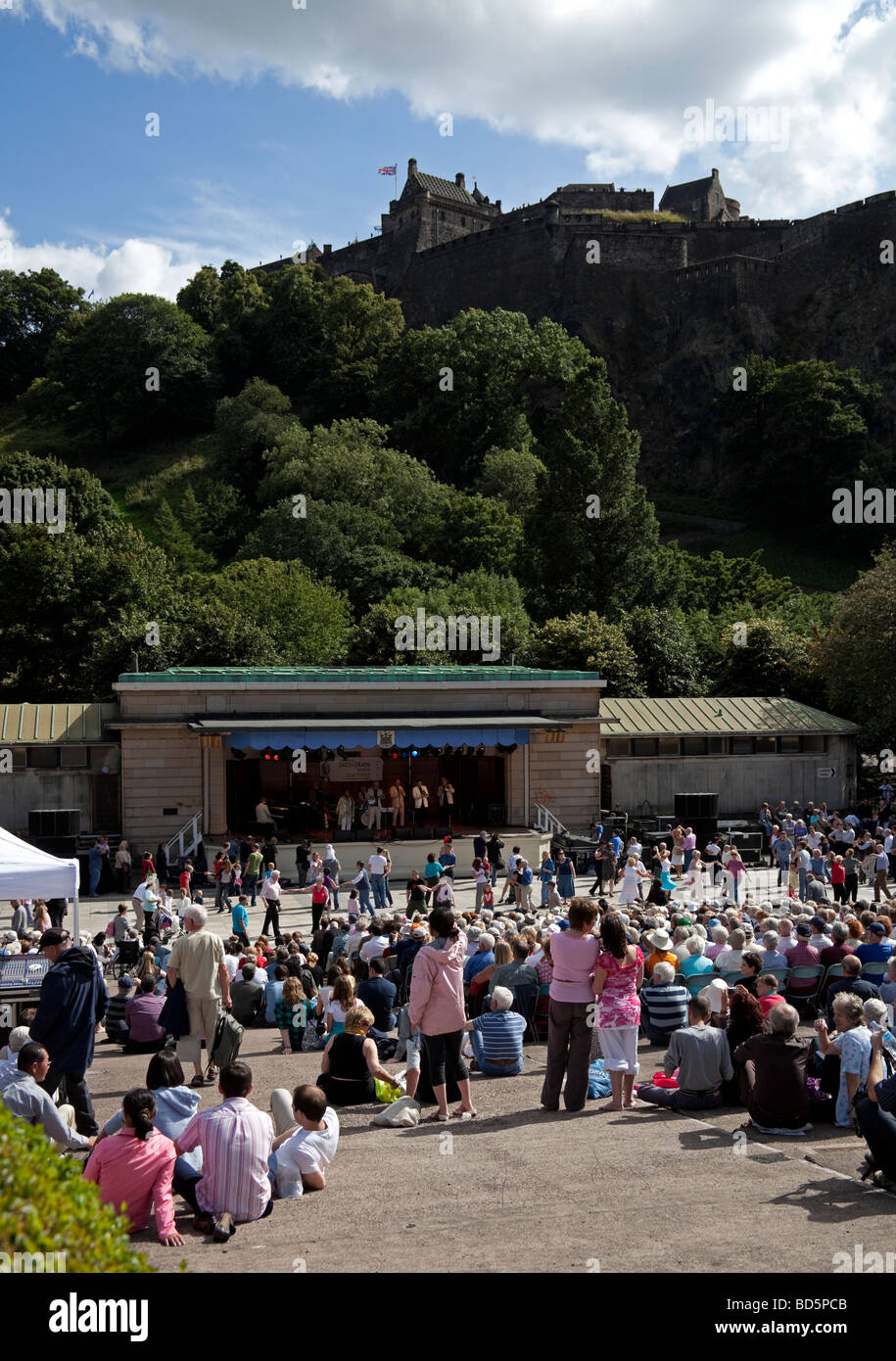 Edinburgh audience at Ross Bandstand with Castle in background during ...