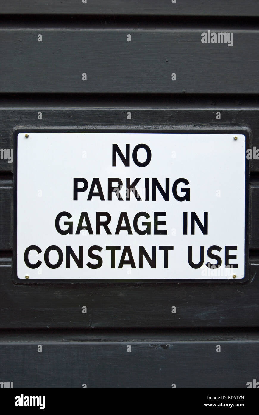 no parking garage in constant use sign on a garage door in twickenham ...