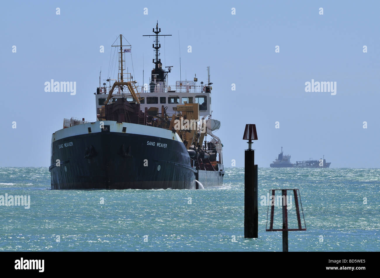 Dredger sailing into Shoreham Port Stock Photo - Alamy