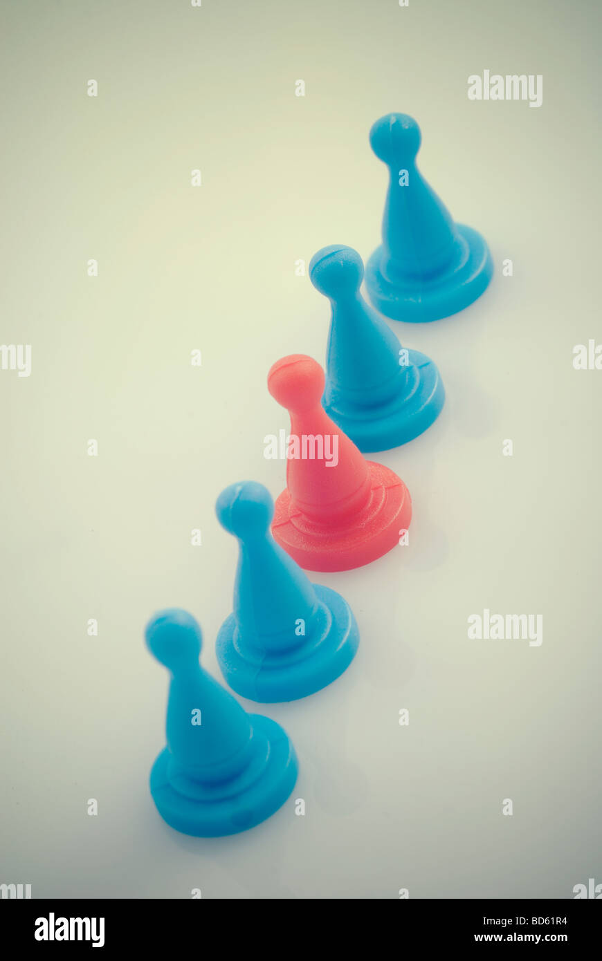 Red and blue playing counters ( standing out from the crowd concept ...