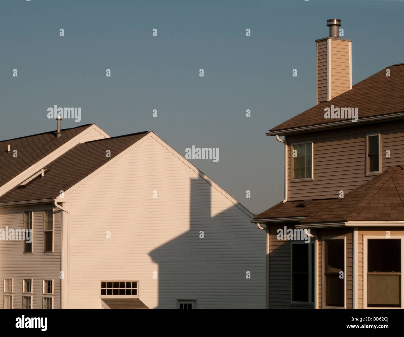 House casting shadow Stock Photo - Alamy
