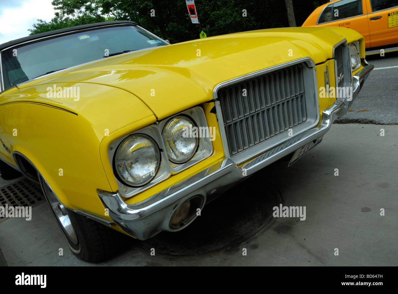 Yellow Oldsmobile Cutlass with vinyl black roof Stock Photo - Alamy