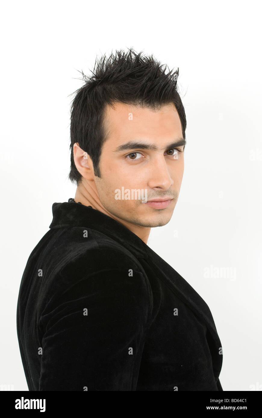 Young man looking over shoulder Stock Photo - Alamy