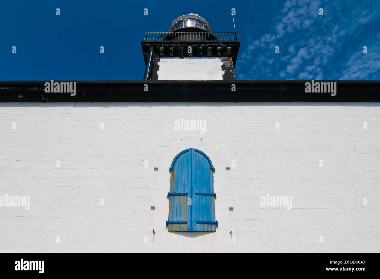 A single window on a white lighthouse wall Stock Photo - Alamy