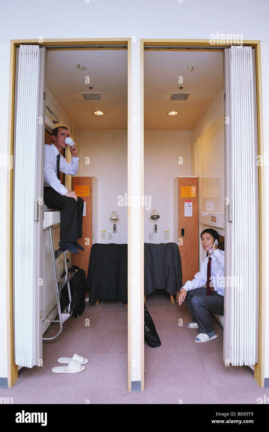 Businessmen sitting in hotel Stock Photo - Alamy