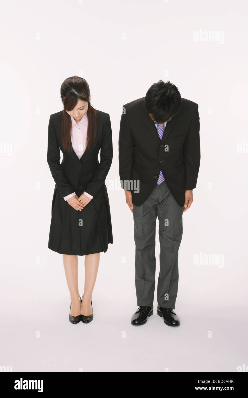 Businesspeople bowing down Stock Photo - Alamy Businesspeople bowing down Stock Photo - Alamy