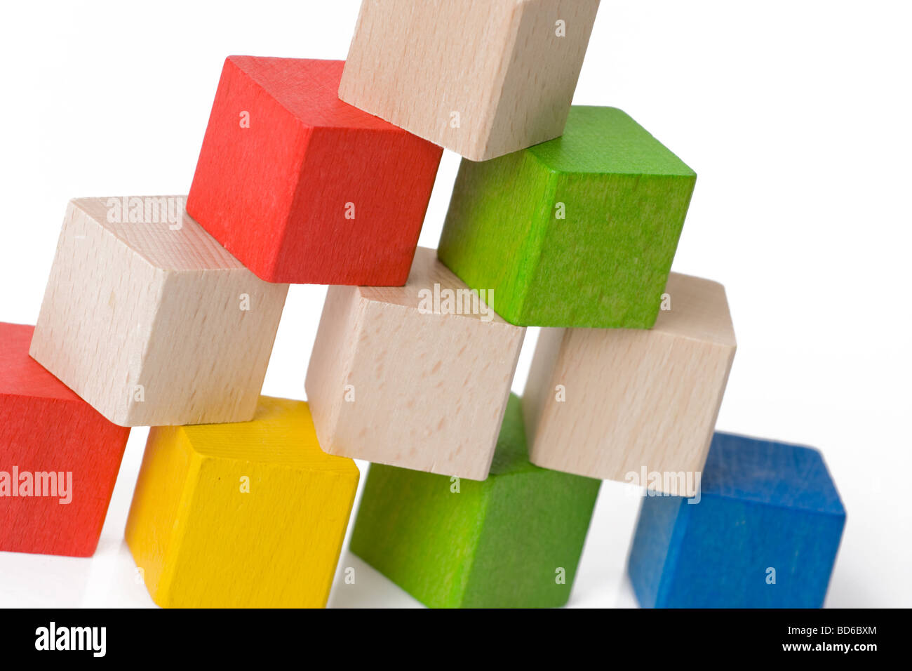 Wooden toy blocks on white background Stock Photo - Alamy