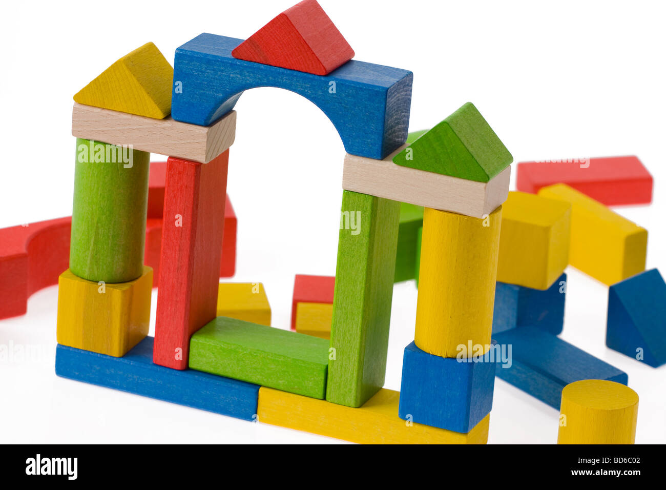 Wooden toy blocks on white background Stock Photo - Alamy