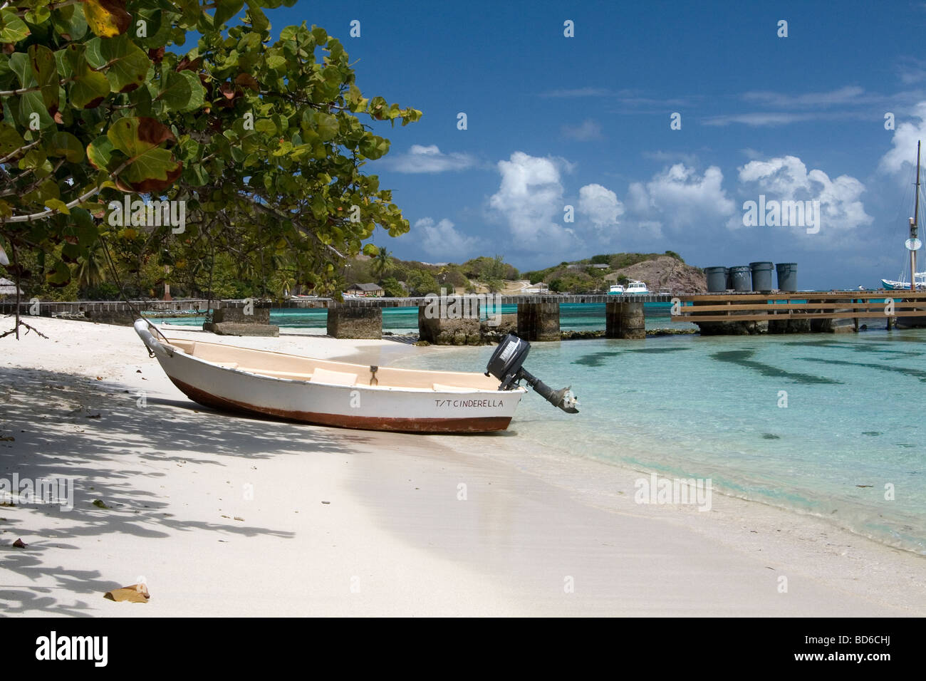 Small Boat on the White Sandy Beach at Petit Saint Vincent with Jetty ...