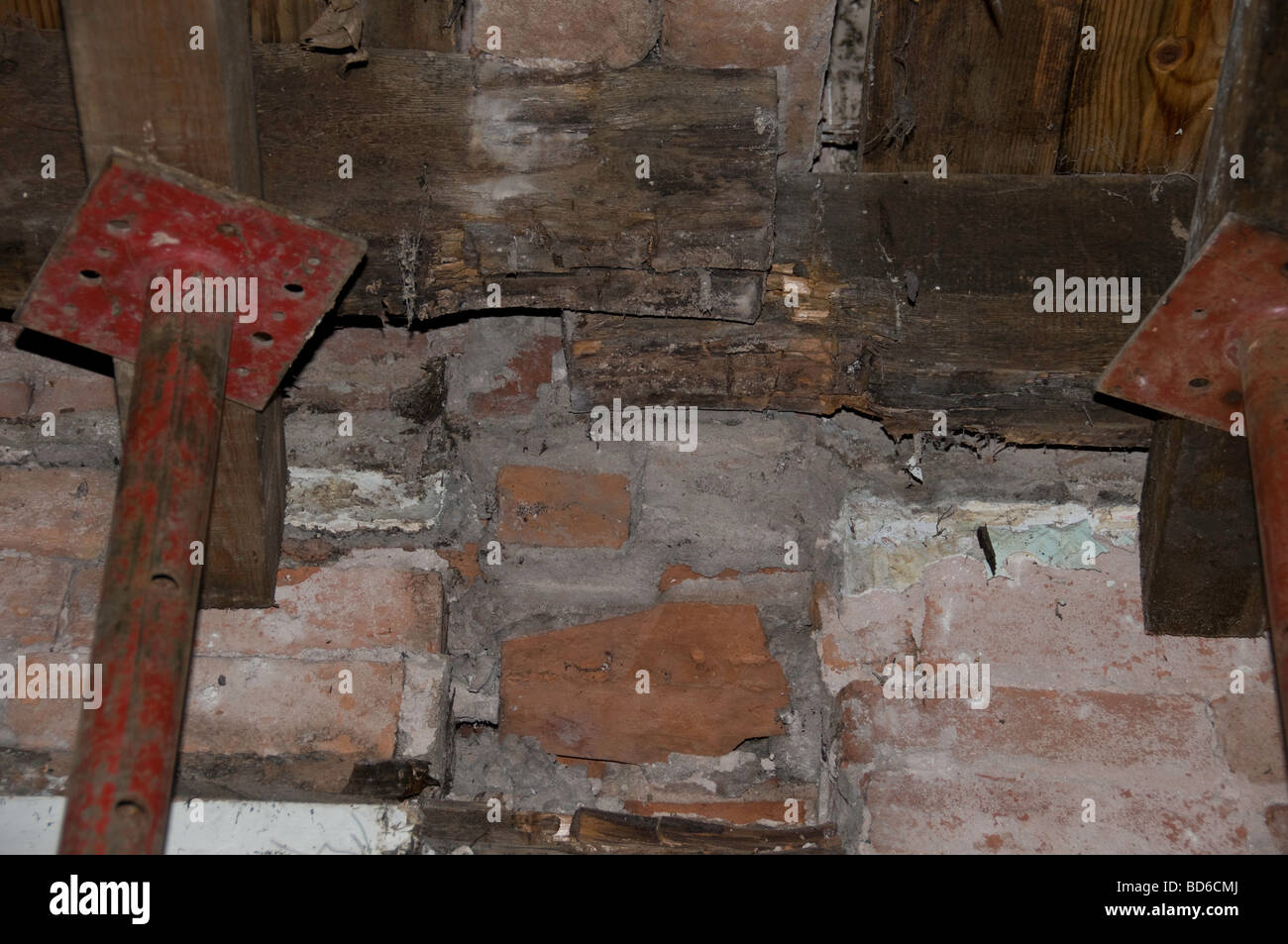 Acro props supporting first floor with rotten joists Stock Photo - Alamy