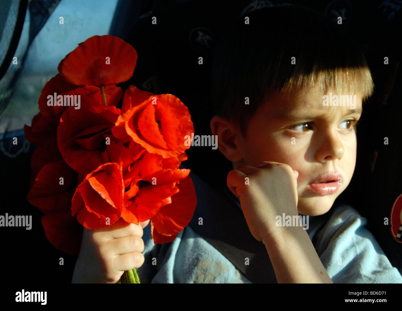 Child with a bunch of flowers Stock Photo - Alamy