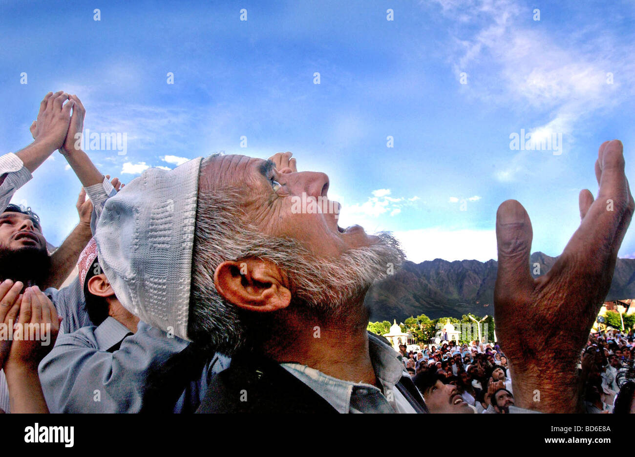 Kashmiri Muslims looks up at what is believed to be a relic of Prophet ...