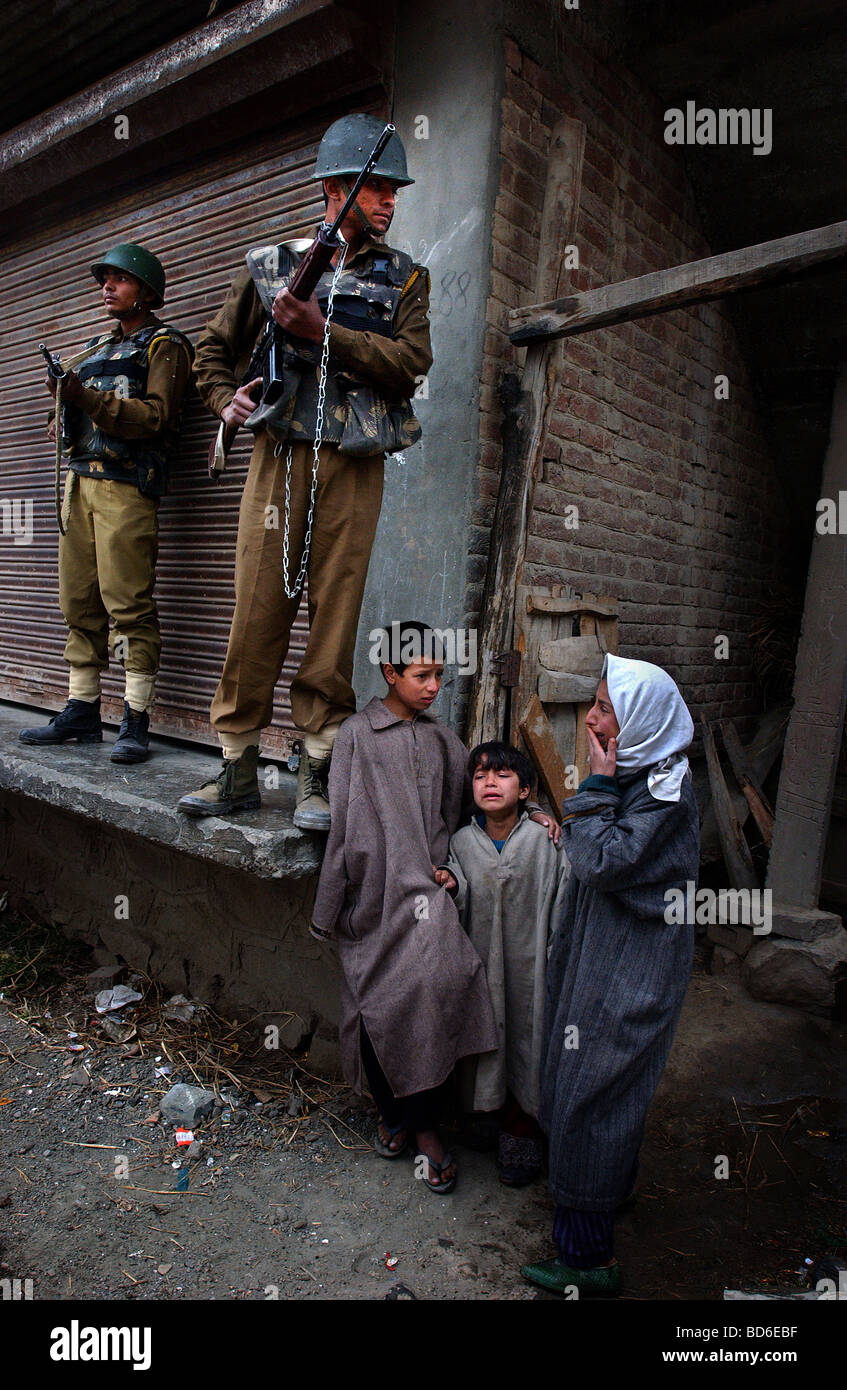 SRINAGAR INDIA MARCH 10 2004 Children cry as Indian army bring back the ...