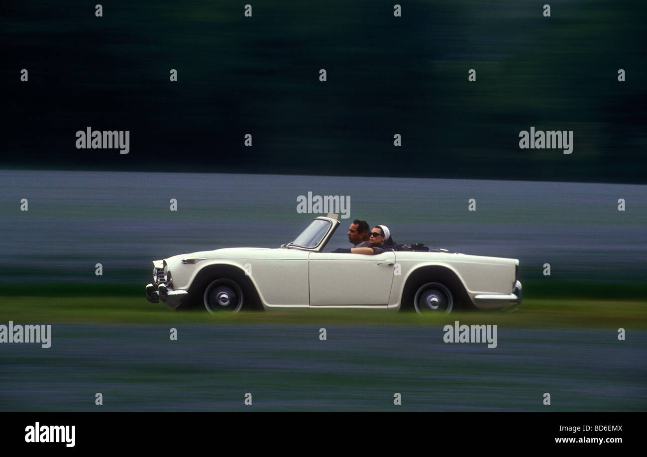 British Sports car driving through English country landscape Stock ...