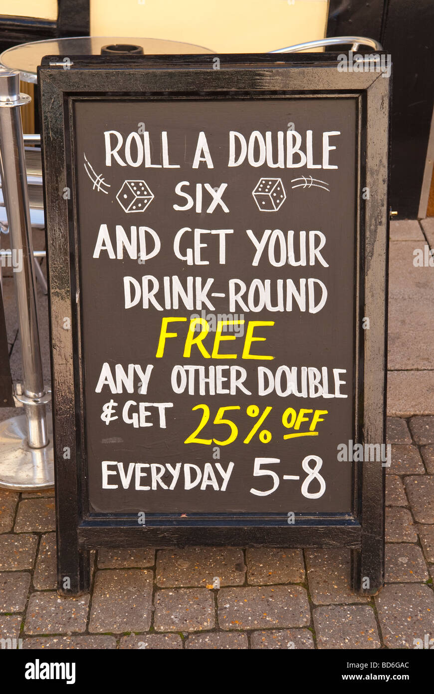 A sign outside a Uk pub advertising drinks promotions and offers Stock ...