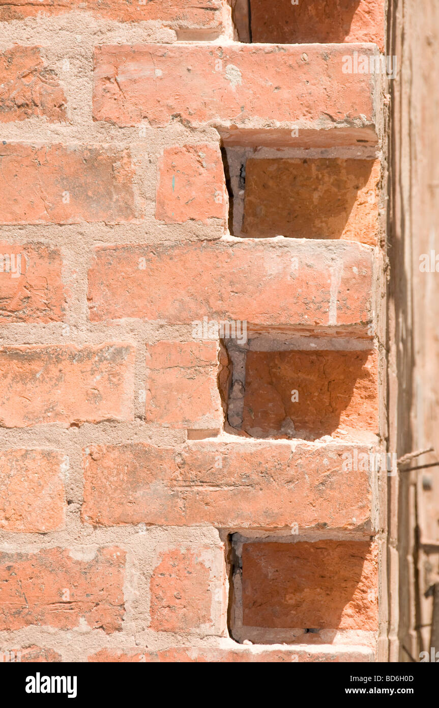 Bricks chopped out of wall for new extension Stock Photo - Alamy