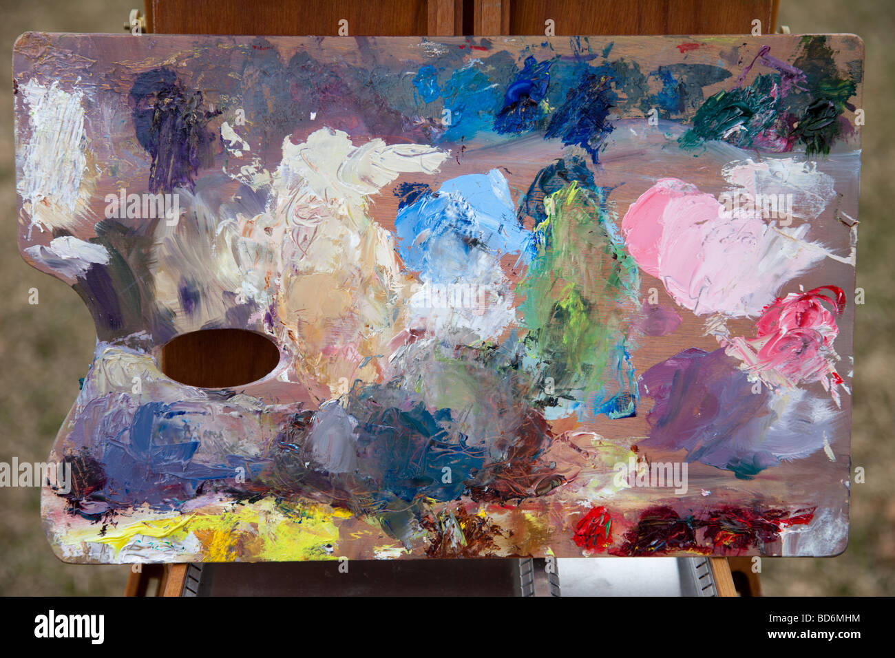 Colorful paints mixed on the artist palette Stock Photo - Alamy