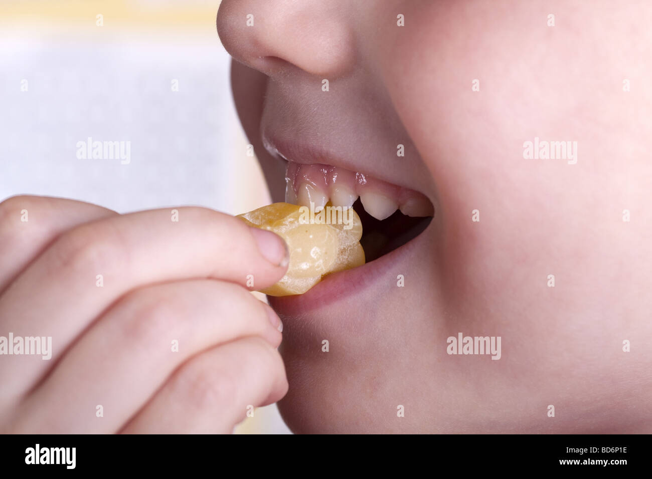 close up shot of child about to eat a jelly baby Stock Photo - Alamy