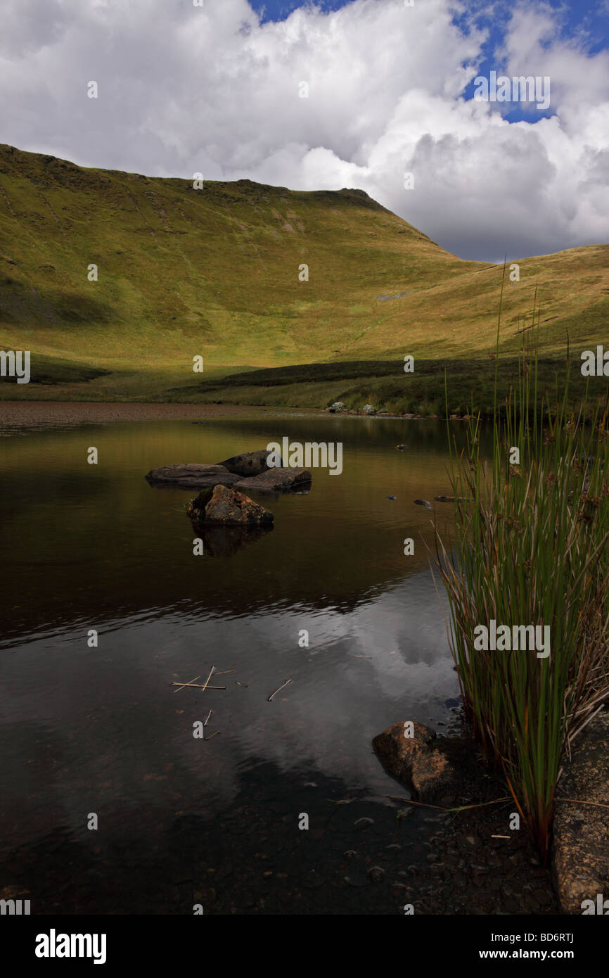 The lake of Llyn Lluncaws, below Cadair Berwyn in the Berwyn mountains ...