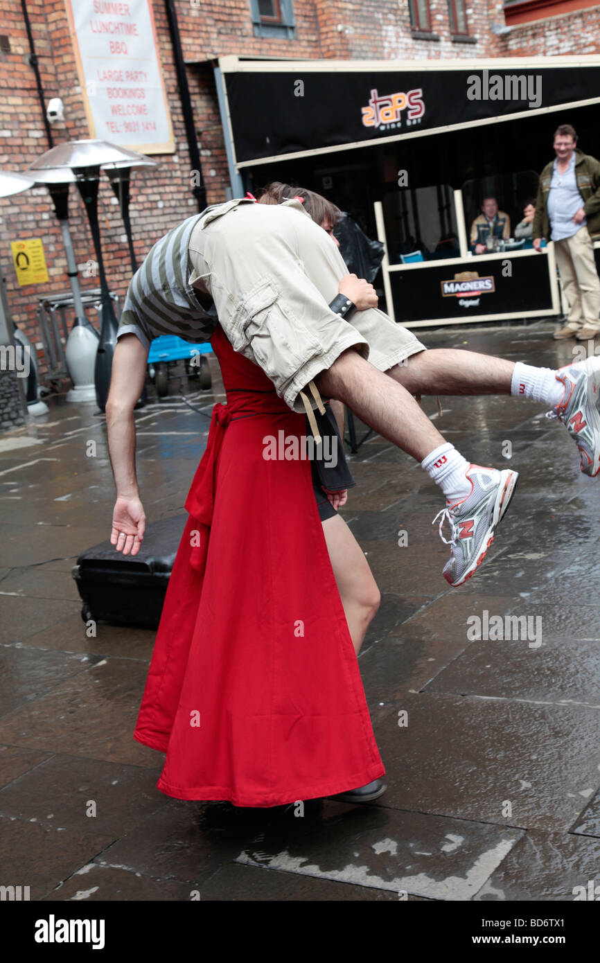 Man carrying woman over shoulder hi-res stock photography and images ...