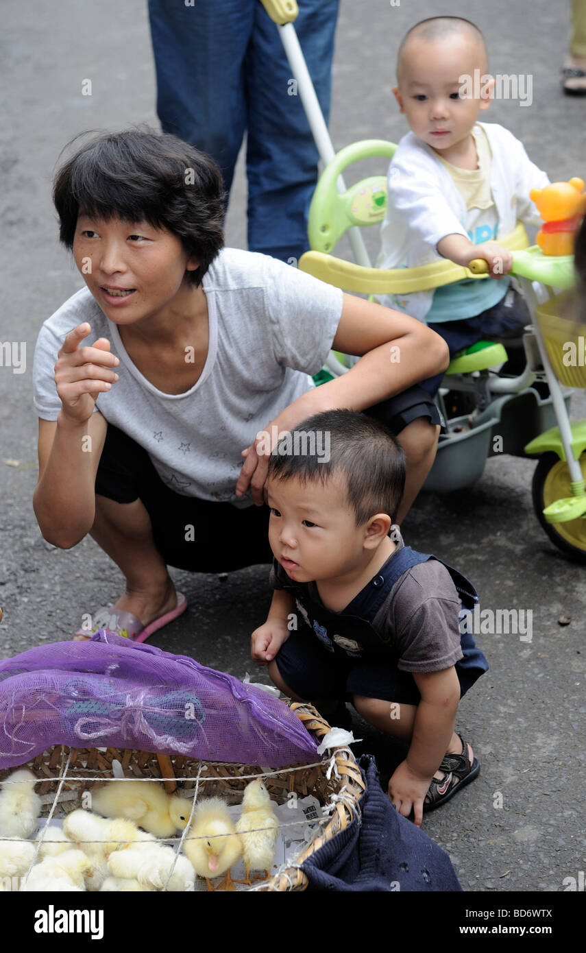 Chinese children playing in Zhengzhou, Hennan, China. 06-Aug-2009 Stock ...