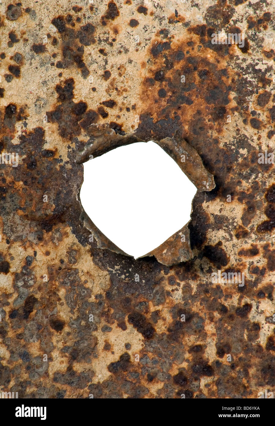 Hole in rusty metal Stock Photo - Alamy