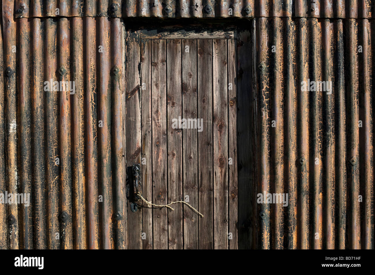 A old rusty corrugated iron garage and wooden door at Saltburn North ...